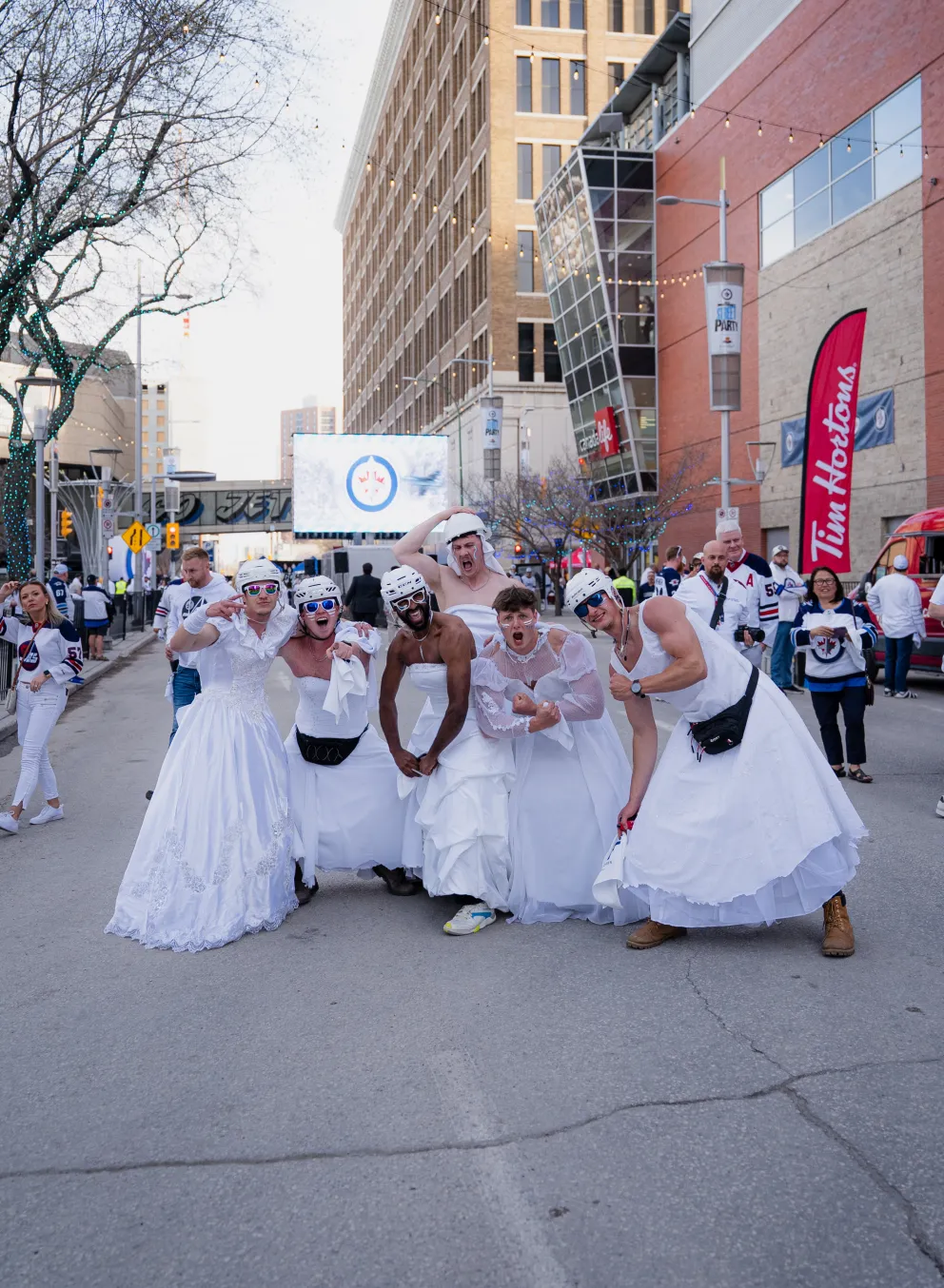 Winkler friends say “I do” to Whiteout fun in thrifted wedding dresses ...